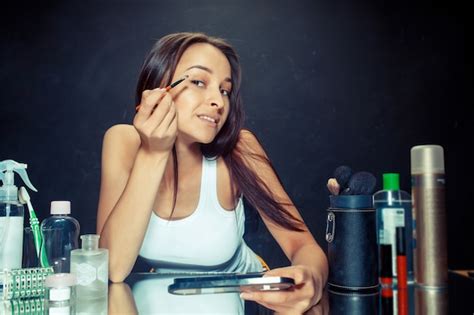 Free Photo Beauty Woman Applying Makeup Beautiful Girl Looking In