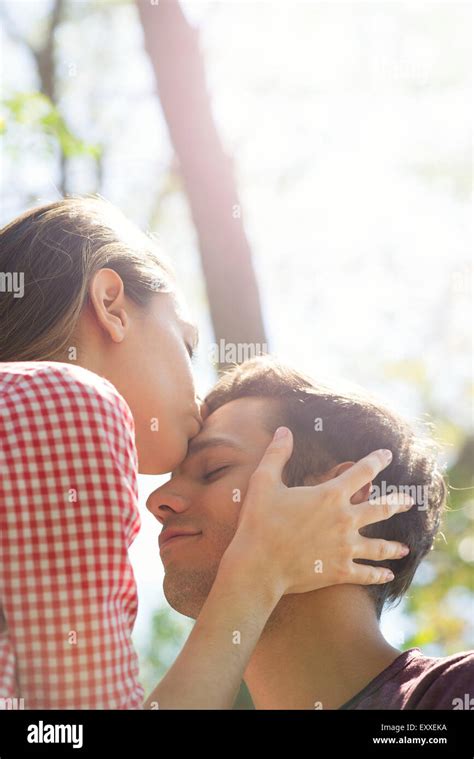 Woman Kissing Boyfriend On Forehead Hi Res Stock Photography And Images