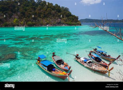 Boats Are Floating On Beach Againts Sky Stock Photo Alamy