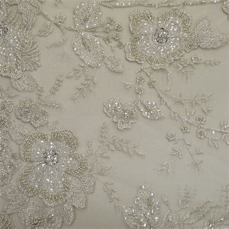 Tissu tulle brodé perlé argent Tissus en Ligne