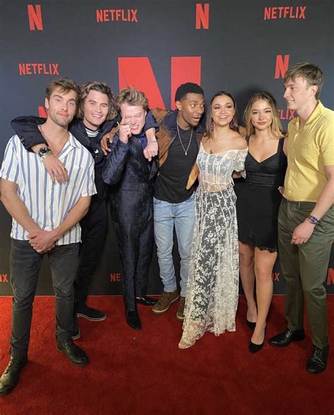 The Cast Of Netflix S Series Nine Poses For A Photo On The Red Carpet