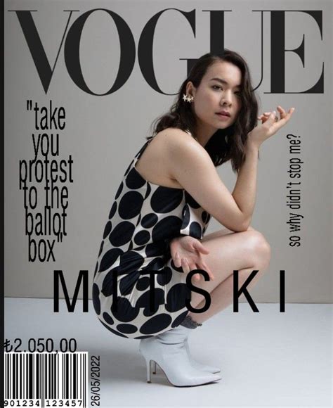 A Woman Sitting On Top Of A Magazine Cover