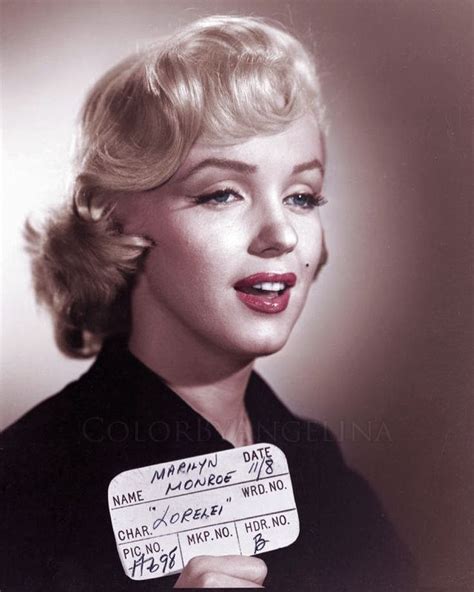 A Woman Holding Up A Sign That Says Happy Mothers Day