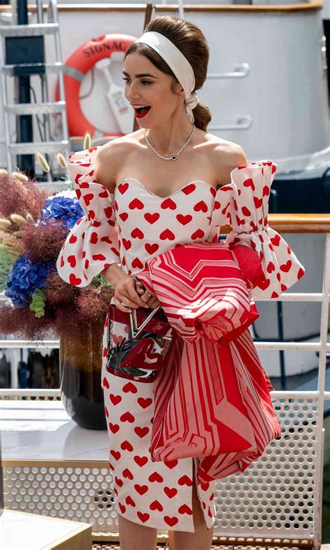 A Woman In A Red And White Dress Is Walking On The Deck Of A Boat