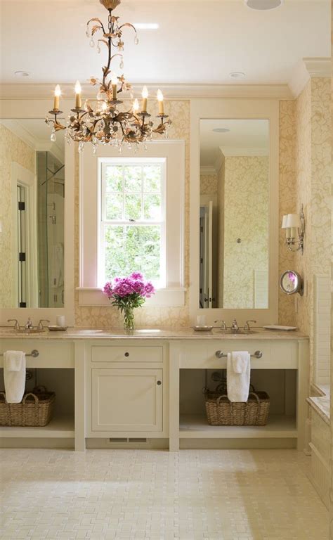 A Large Bathroom With Two Sinks And A Chandelier