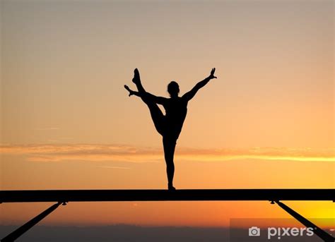 Wall Mural Silhouette Of Female Gymnast On Balance Beam In Sunset