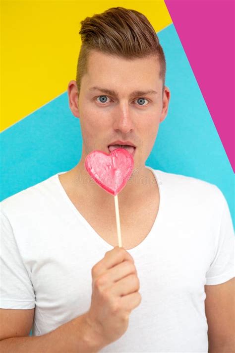 Handsome Blond Man Licking On Heart Shaped Lollipop Stock Image Image Of People Hold 127815879