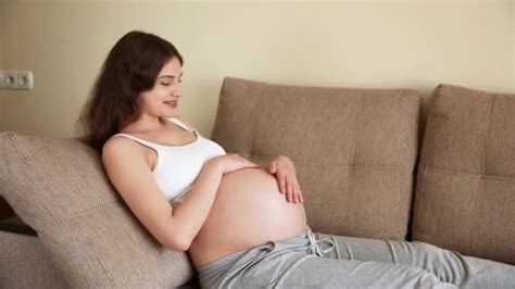 Portrait Caring Mother Strokes Naked Pregnant Tummy Two Hands Light