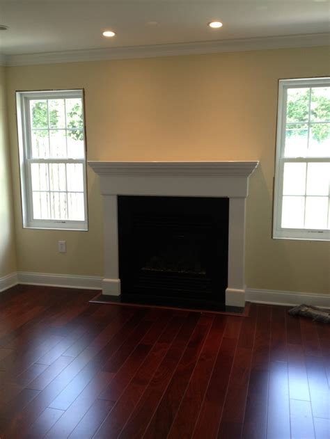 Black Absolute Surround Gas Fireplace With Wood Mantle