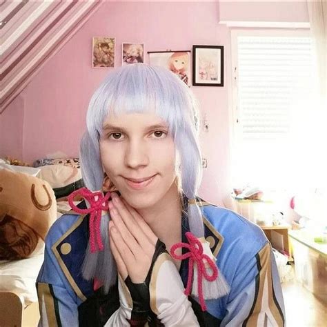 A Woman With Blue Hair And Pink Wig Posing For A Photo