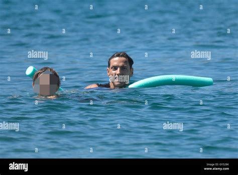 Pier Silvio Berlusconi And Silvia Toffanin Taking A Swim In The Sea