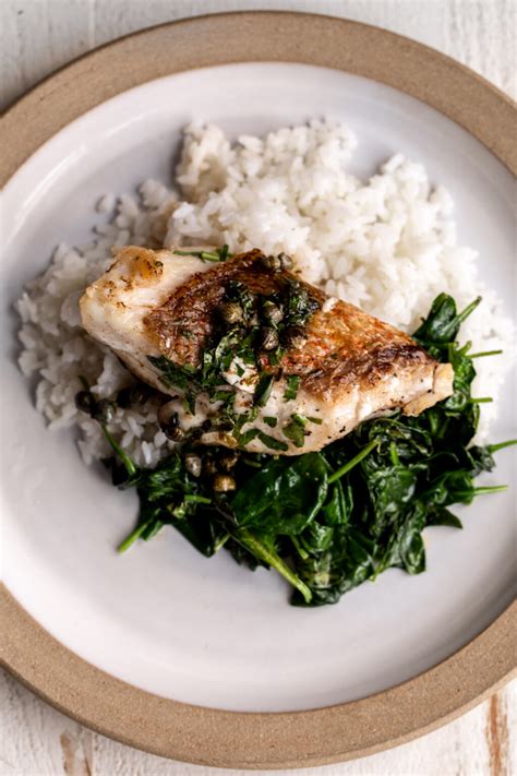 Pan Seared White Fish Cooking With Cocktail Rings