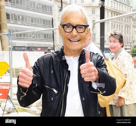 Hairdresser And Businessman Vidal Sassoon Gives The Thumbs Up While Out For A Stroll At 82