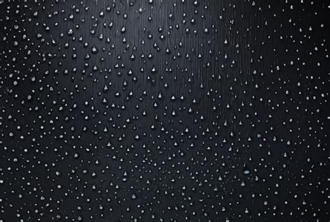 Gotas De Lluvia Sobre Un Fondo Negro Foto Premium