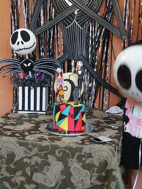 A Table Topped With Two Cakes Covered In Frosting And Decorated Like