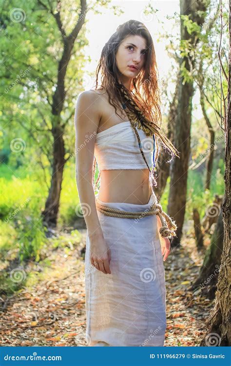 Pagan Woman Curiously Wondering Through The Forest Stock Image Image