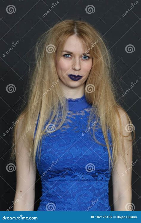 Beautiful Blonde European Girl With Blue Eyes Posing In Studio On