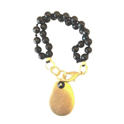 Pulsera de cristal negro con lágrima colgando Todo en oro mate de 18