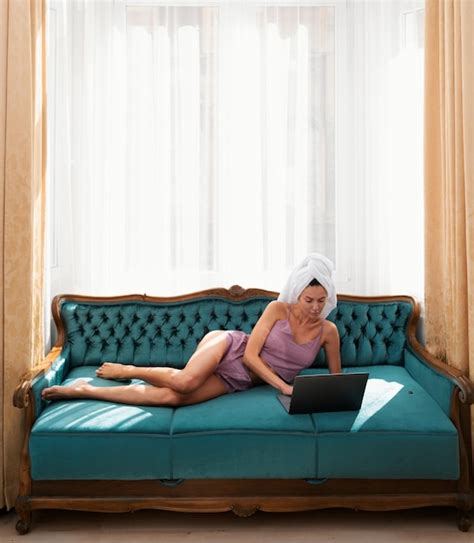 Premium Photo Young Beautiful Women In White Bathrobes And Towels Using Laptop Computer In