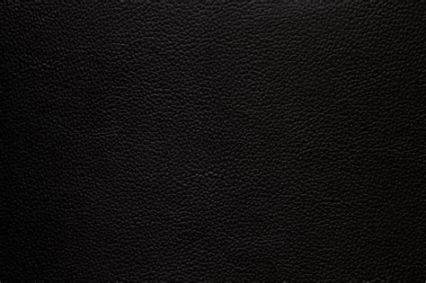 A Black Leather Texture Background With Some Light Spots