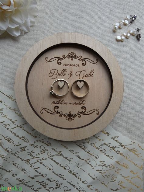 Personalized Wooden Keepsake With Wedding Rings And Pearl Necklaces On