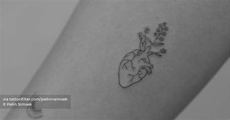 Anatomical Heart And Flowers Tattoo Done On The Inner
