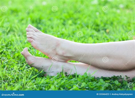 Barefooted Attractive Female Feet On Green Grass Stock Photography