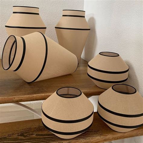 Several Vases Are Lined Up On A Shelf