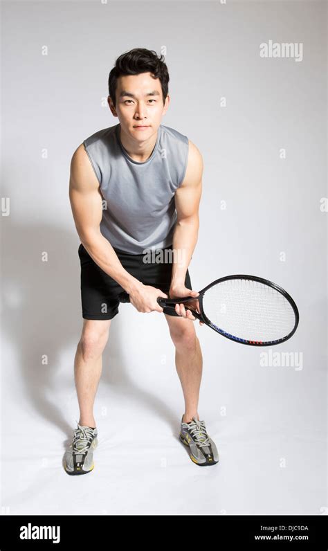 Athletic Male Holding Tennis Racquet Stock Photo Alamy