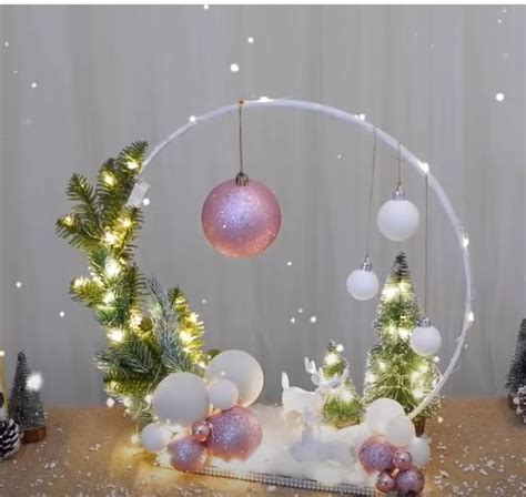 A Table Topped With Christmas Decorations And Lights