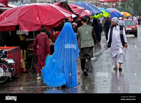 An Afghan Woman Walks Through The Old Market In Downtown Kabul