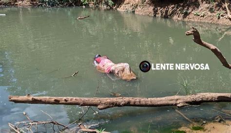 IMAGENS FORTES Cadáver mãos amarradas e enrolado em lençol é