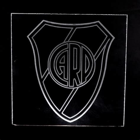 A Black And White Photo Of The Emblem Of A Soccer Team On A Dark Background