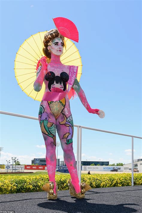 Women Wearing Nothing But Colourful Paint Bare All As They Strut The