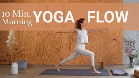 A Woman Doing Yoga In Front Of A Wooden Wall With The Words Min
