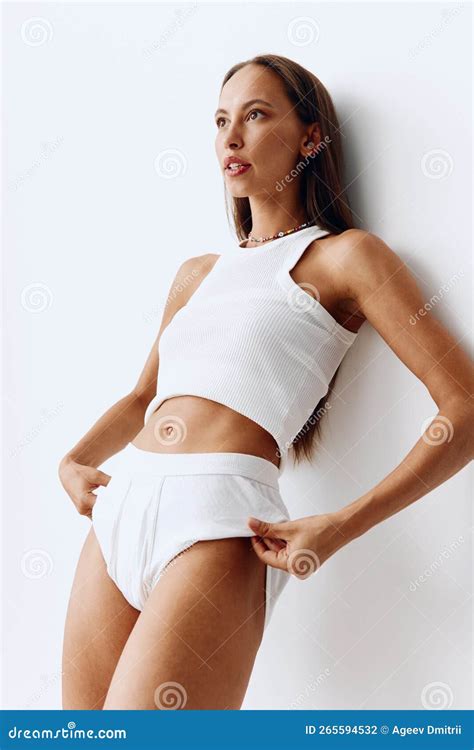 A Beautiful Woman With Tanned Skin And A Beautiful Slender Body And