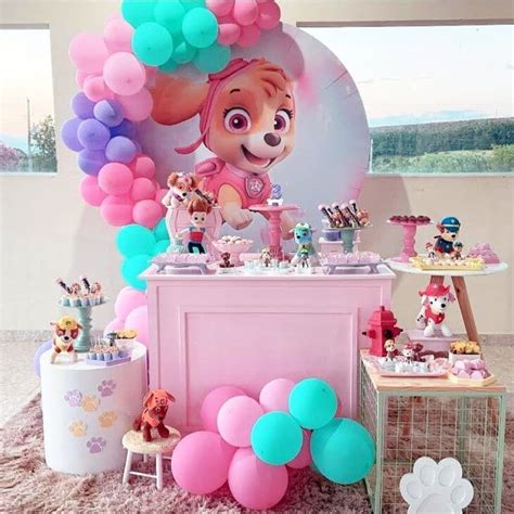 A Birthday Party With Balloons And Decorations