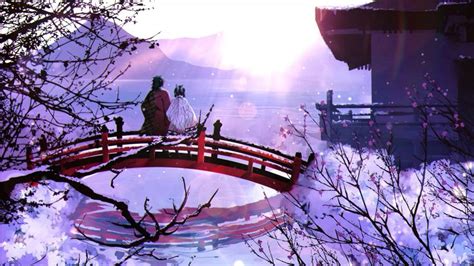 Two People Standing On A Red Bridge Over Water