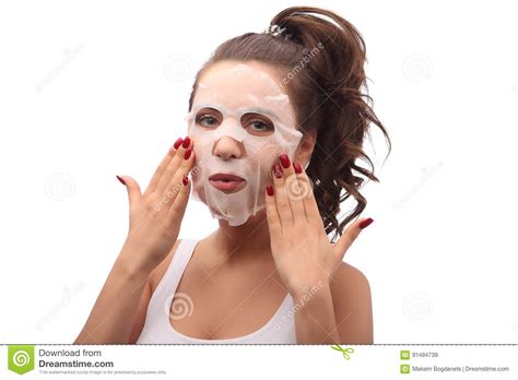 Brunette Woman Doing Facial Mask Sheet Beauty And Skin Care Concept Girl Applying Facial Mask
