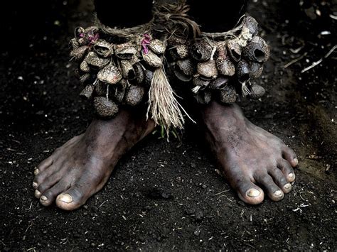 Tribesman With Dried Seeds On The Feet During The Palm Tree Dance Of