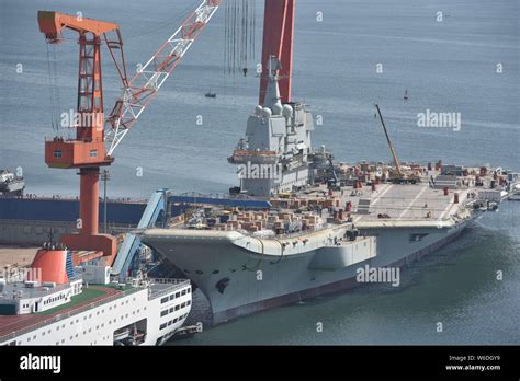 Chinese Workers Labor On The Deck Of China S First Domestically Built