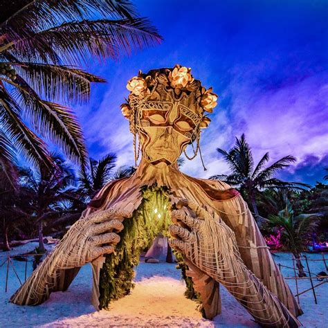 A Towering Wooden Sculpture By Daniel Popper Welcomes Beachgoers In