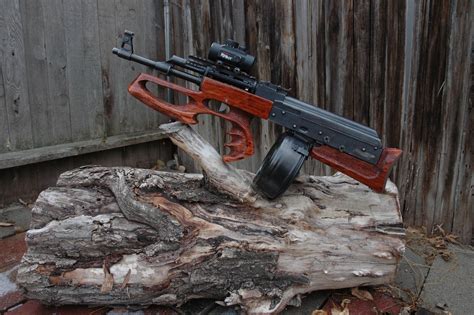 HD Wallpaper Of A Man Made AK 47 On Rustic Wood