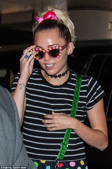 Miley Cyrus Puts On A Colour Clashing Display As She Arrives At LAX