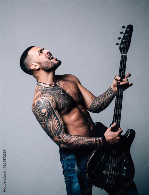 Expressive Young Man Playing Rock N Roll Music On Electric Guitar Excited Sexy Man With