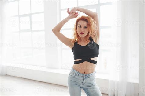 Good Moves Attractive Redhead Woman Posing In The Spacey Room Near The Window 8681276 Stock