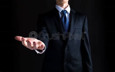 Man Holding His Hands Out And Showing Something Stock Photo 855723
