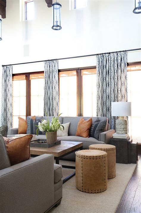A Living Room Filled With Furniture And Lots Of Windows