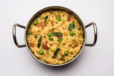 Premium Photo Vegetable Dalia Or Daliya Khichadi Or Broken Wheat