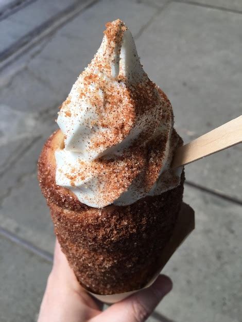 Premium Photo Cropped Hand Holding Ice Cream Cone